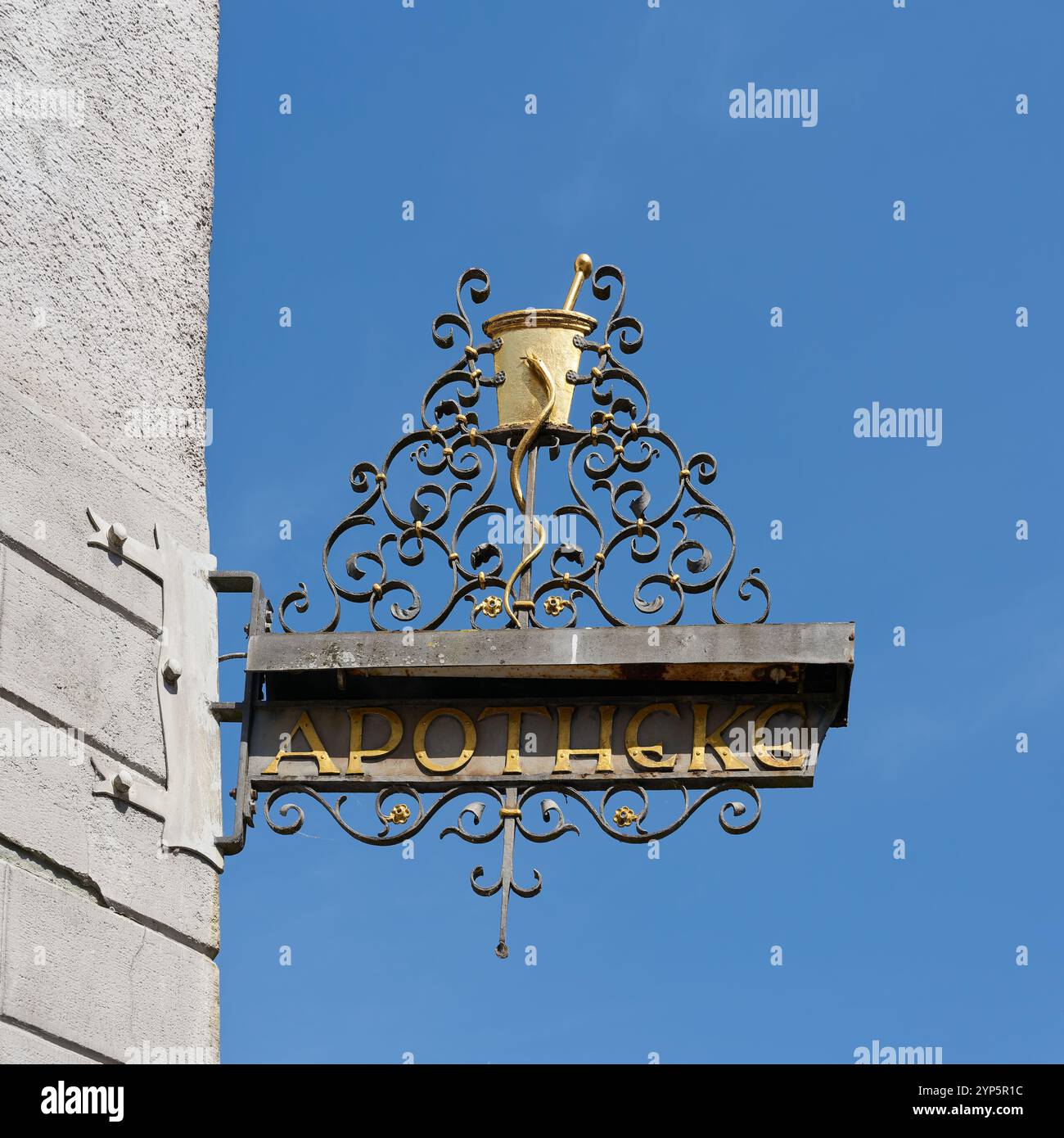 Guild sign on the facade of an old pharmacy in the old town of ...