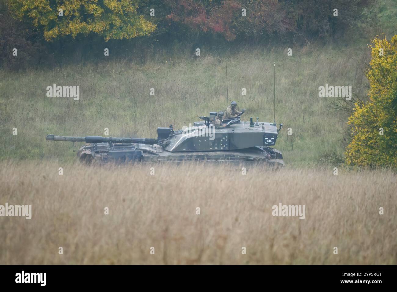 commander and gunner direct a Challenger 2 II FV4043 tank in pouring ...