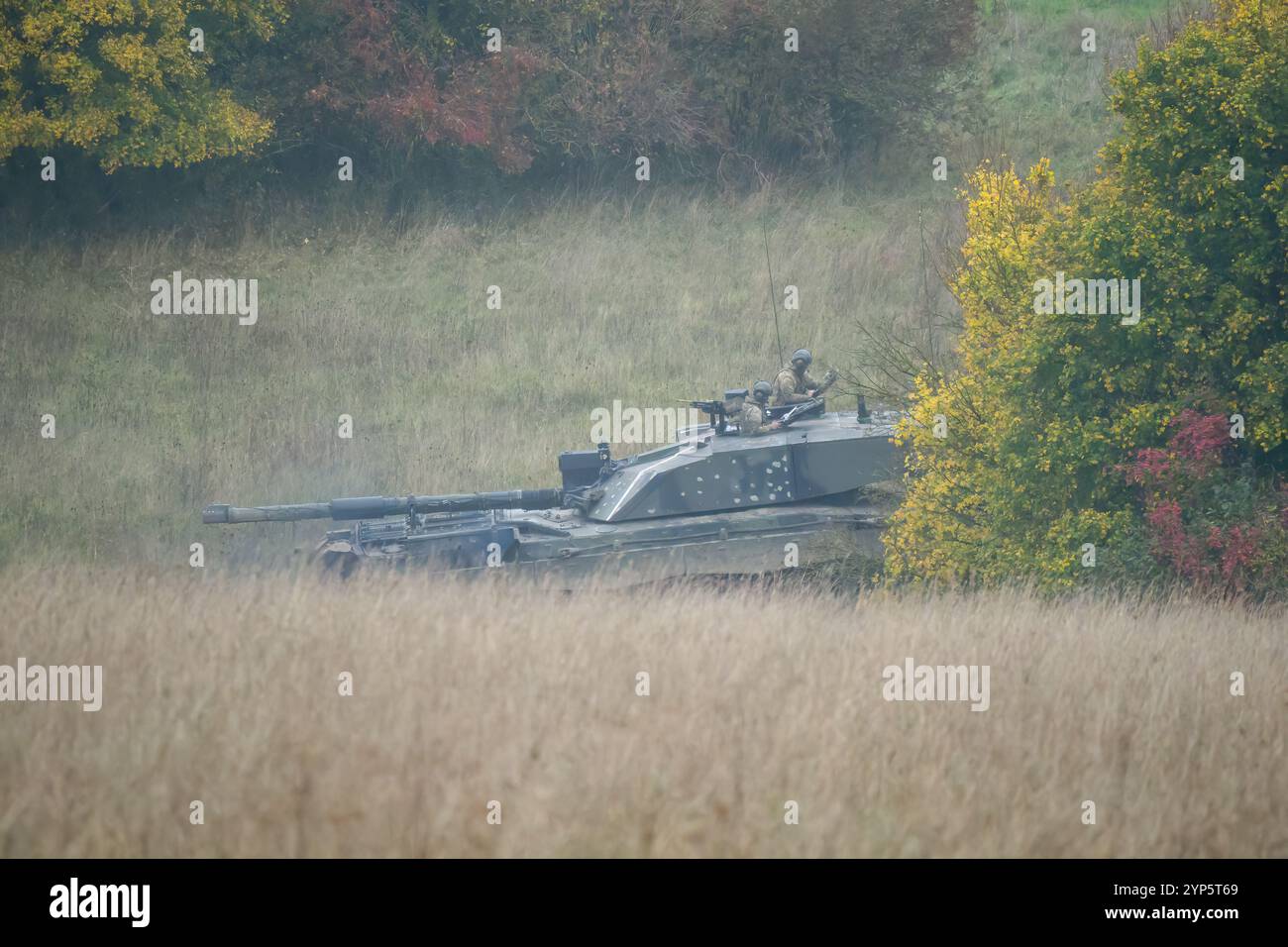 commander and gunner direct a Challenger 2 II FV4043 tank in pouring ...