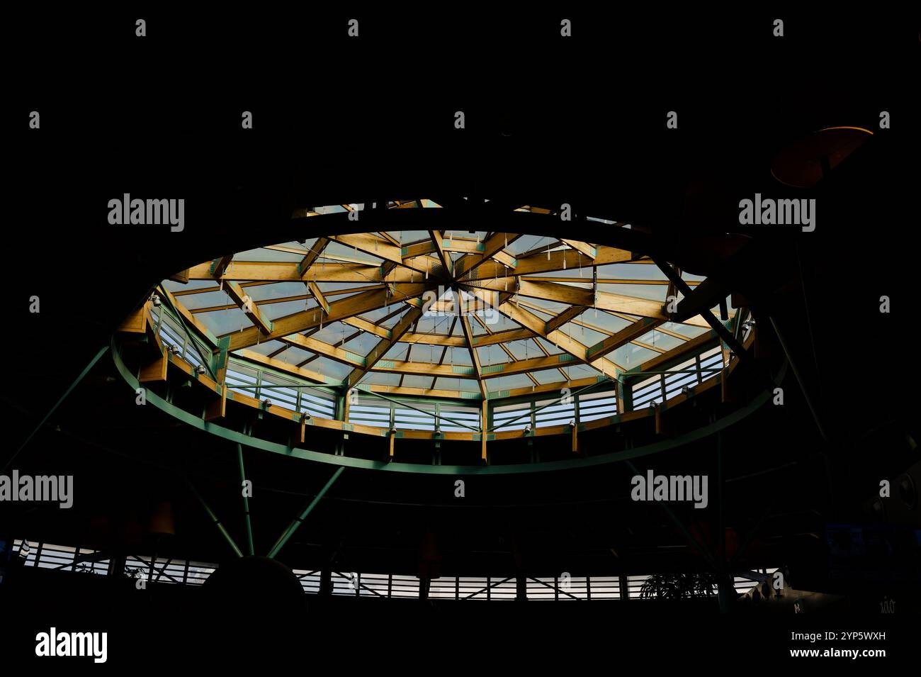 Architectural skylight with geometric wooden beams filtering sunlight ...