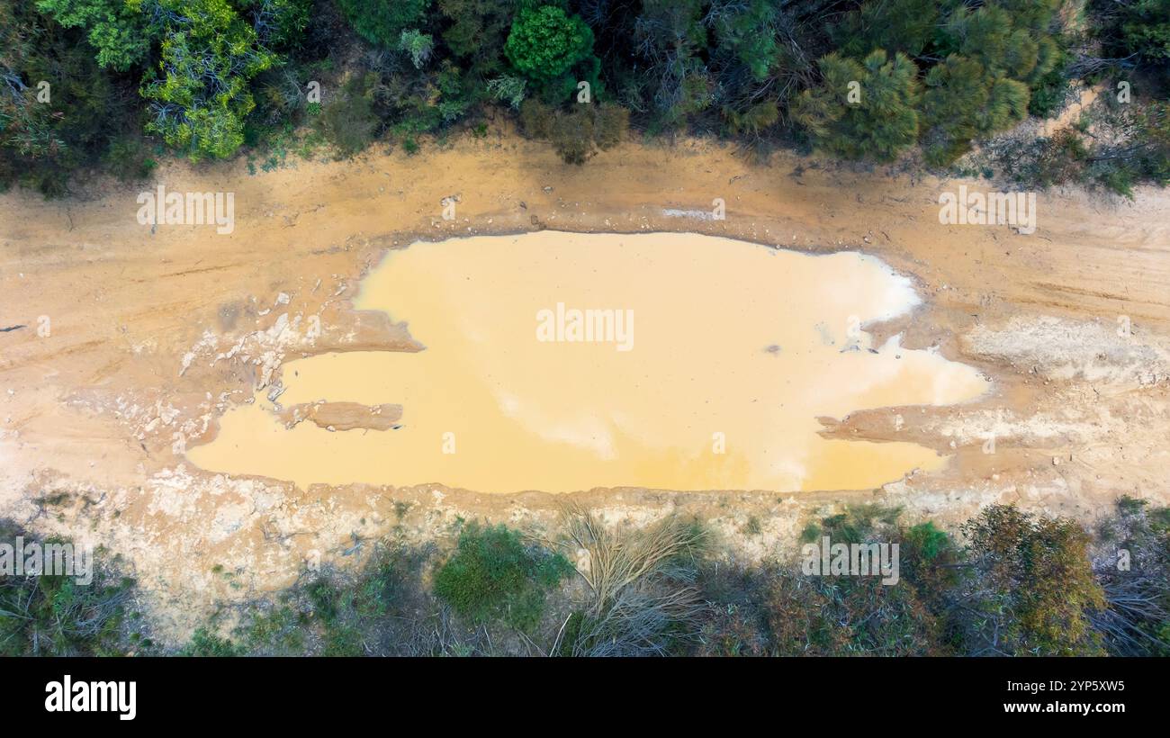 Drone aerial photograph of flooding on a dirt track running through ...