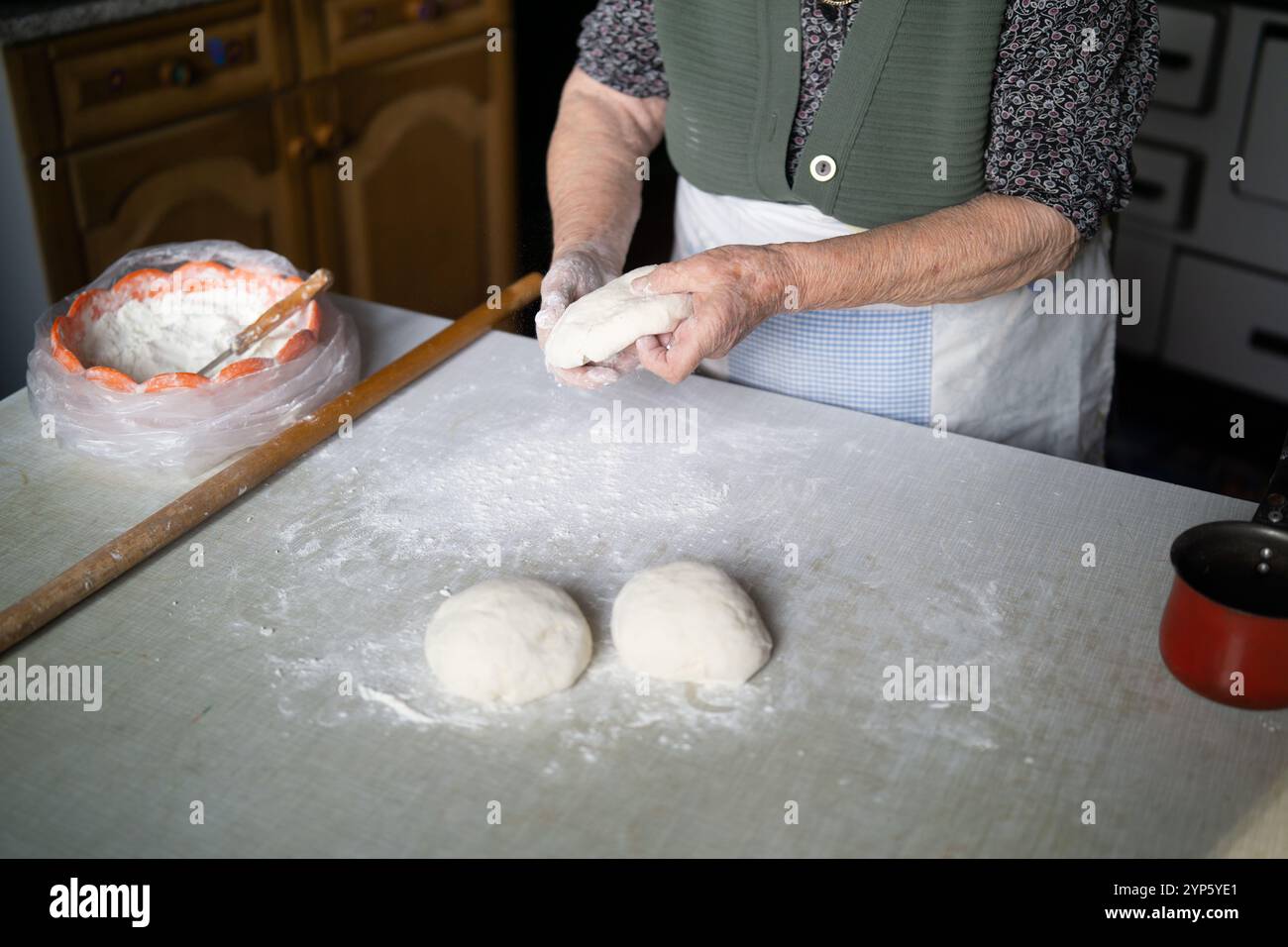 Old woman kneading dough close up Stock Photo - Alamy