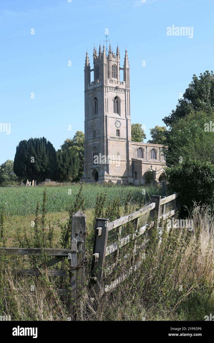 English Norman Church countryside place fence gate British land Christian hedge gate sky blue ...