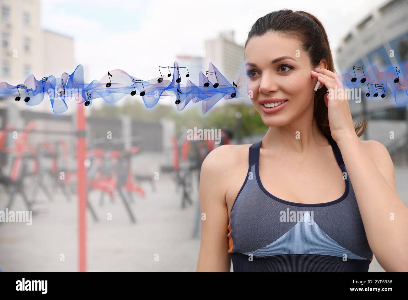Beautiful woman with earphones near outdoor gym. Music notes and sound ...