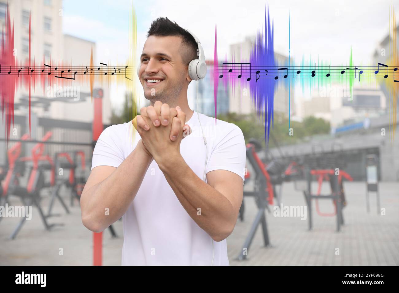 Man with headphones doing exercise near outdoor gym. Music notes and ...