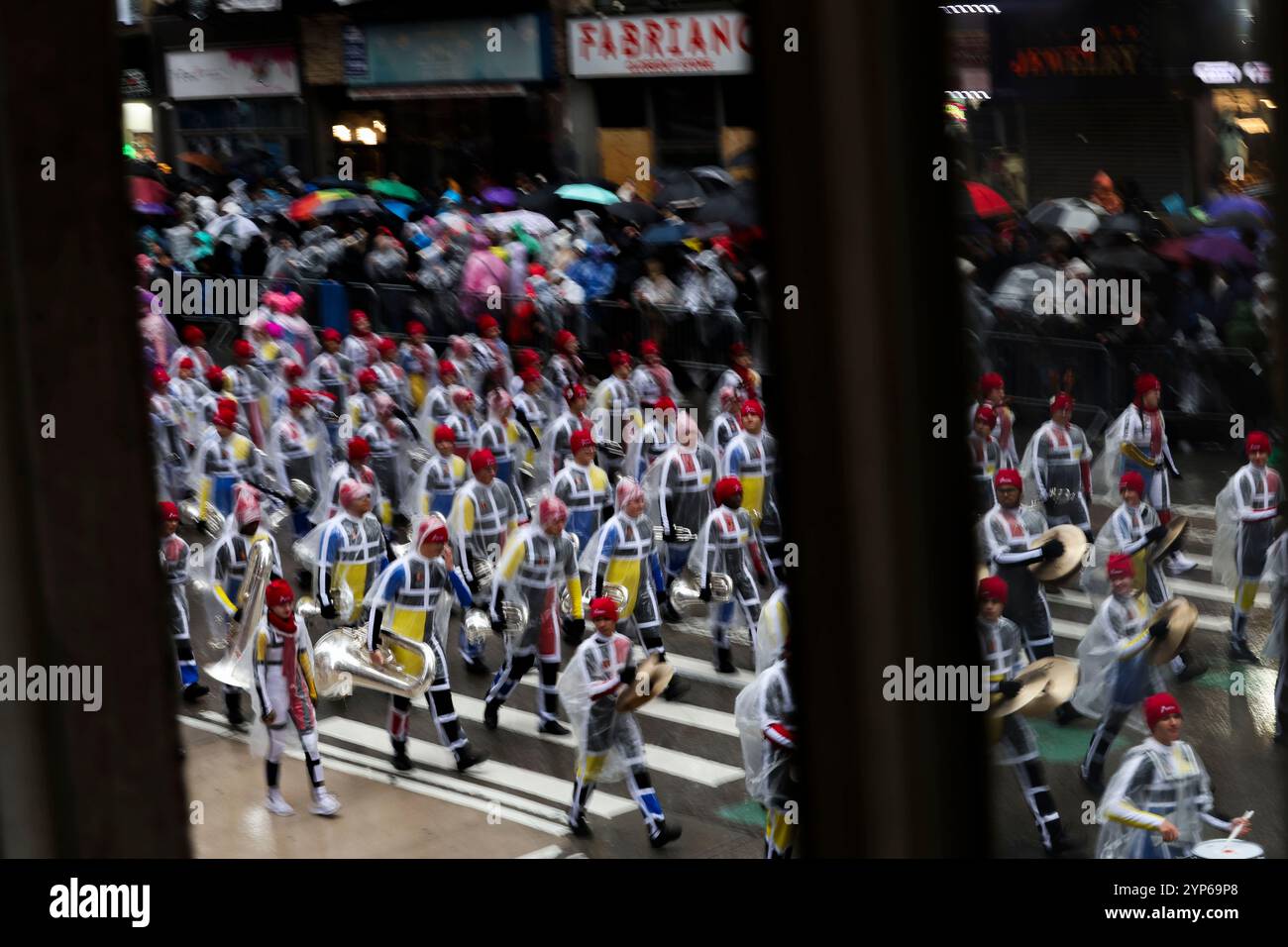 The Avon High School marching band passes during the Macy's ...