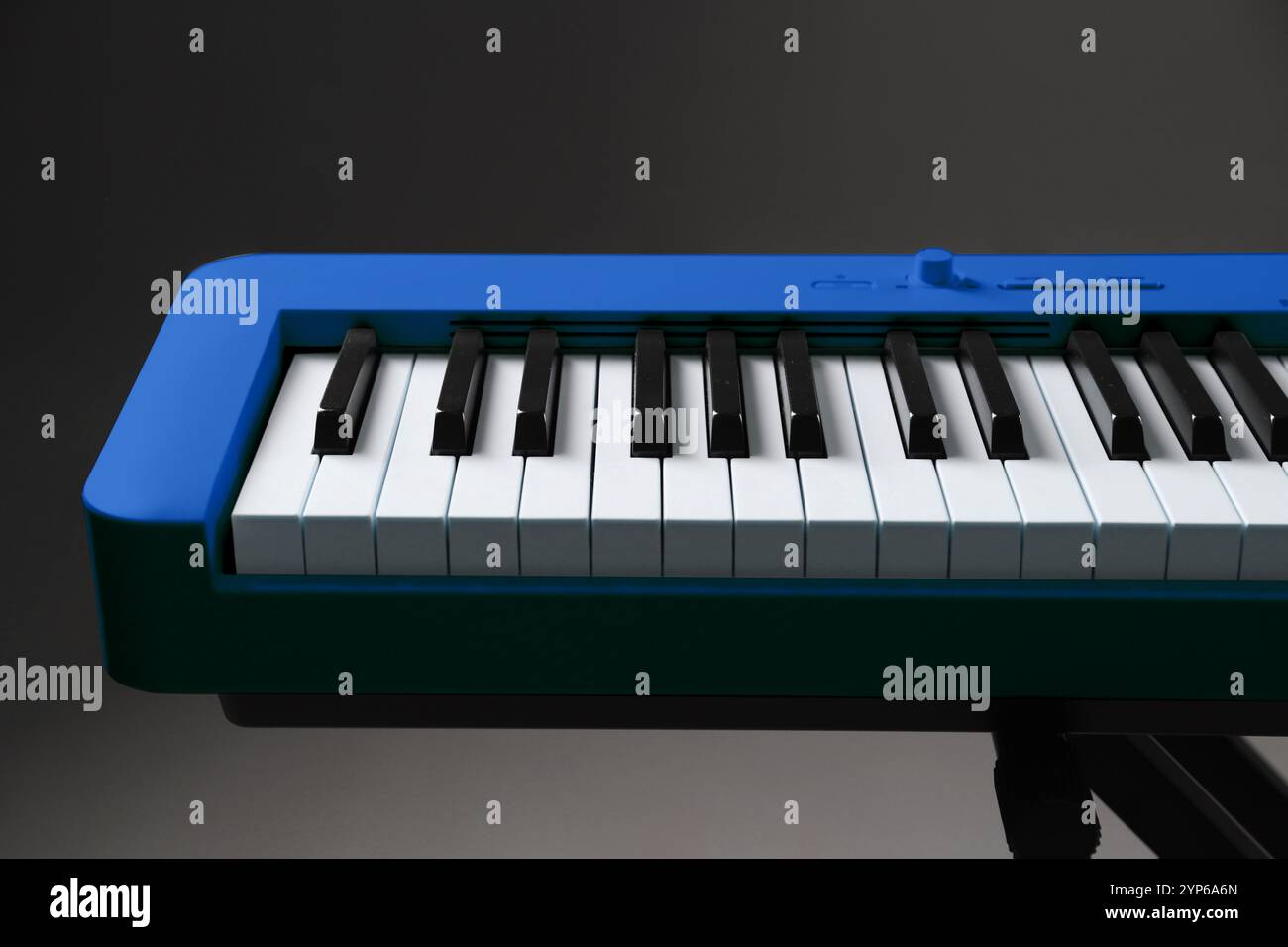 Blue synthesizer on dark background. Electronic musical instrument ...