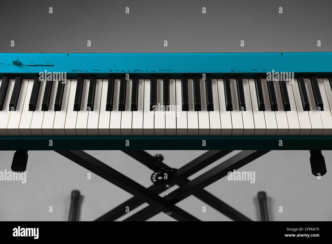 Light blue synthesizer on dark background. Electronic musical ...