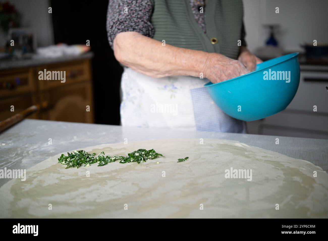 Senior woman making pie at home Stock Photo - Alamy