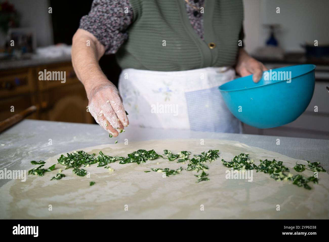 Senior woman making pie at home Stock Photo - Alamy