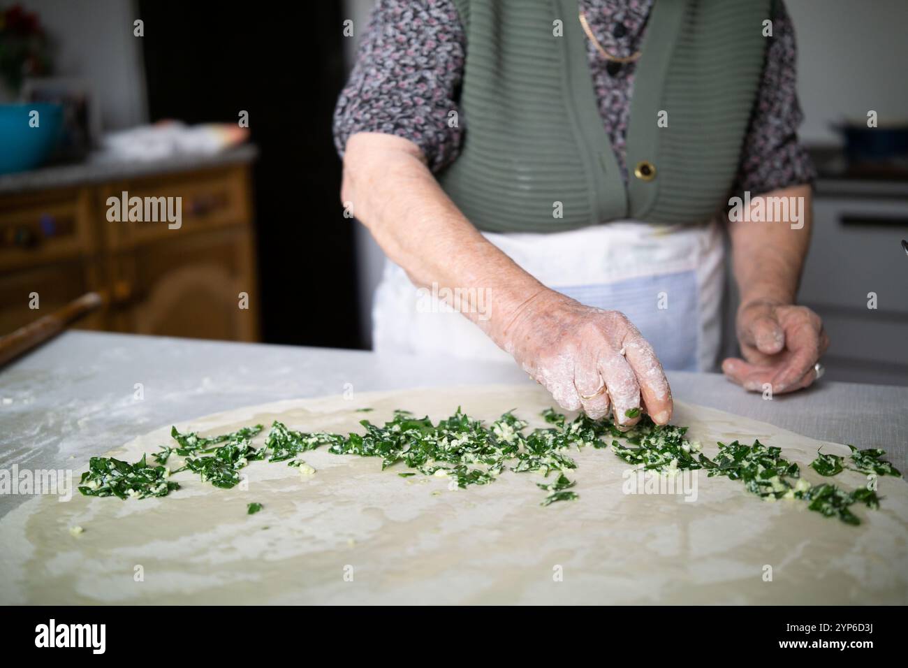 Senior woman making pie at home Stock Photo - Alamy