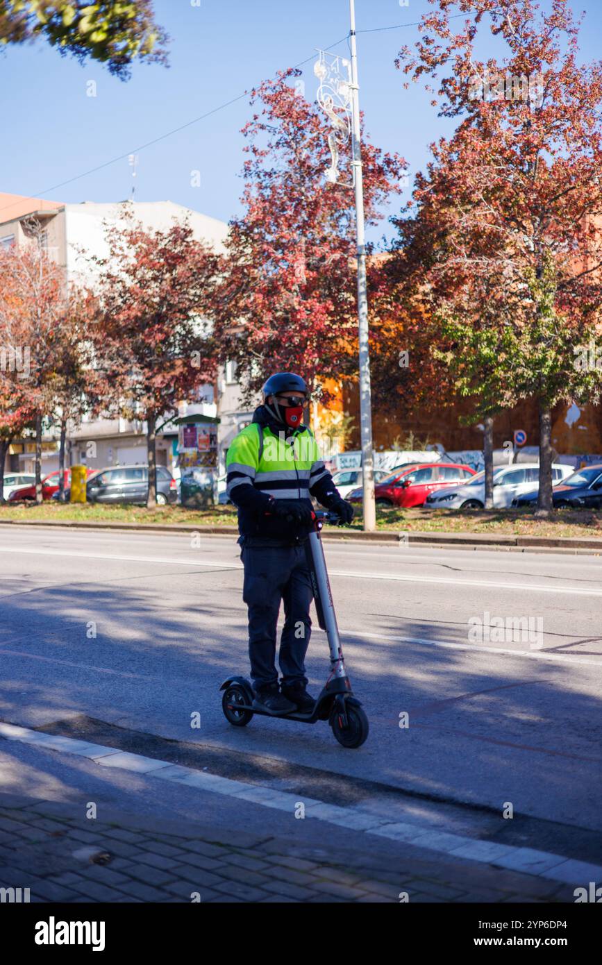 Barcelona-Spain, 28 de noviembre de 2024. A person rides an electric ...