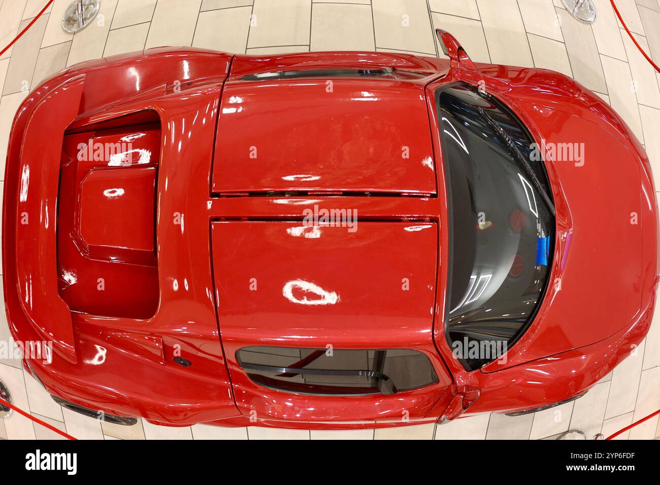 A collection of restored classic and luxury cars displayed at a vintage ...