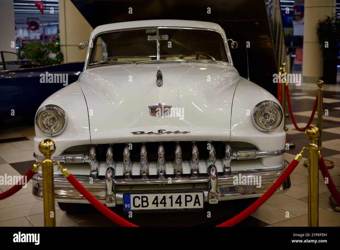 A collection of restored classic and luxury cars displayed at a vintage ...