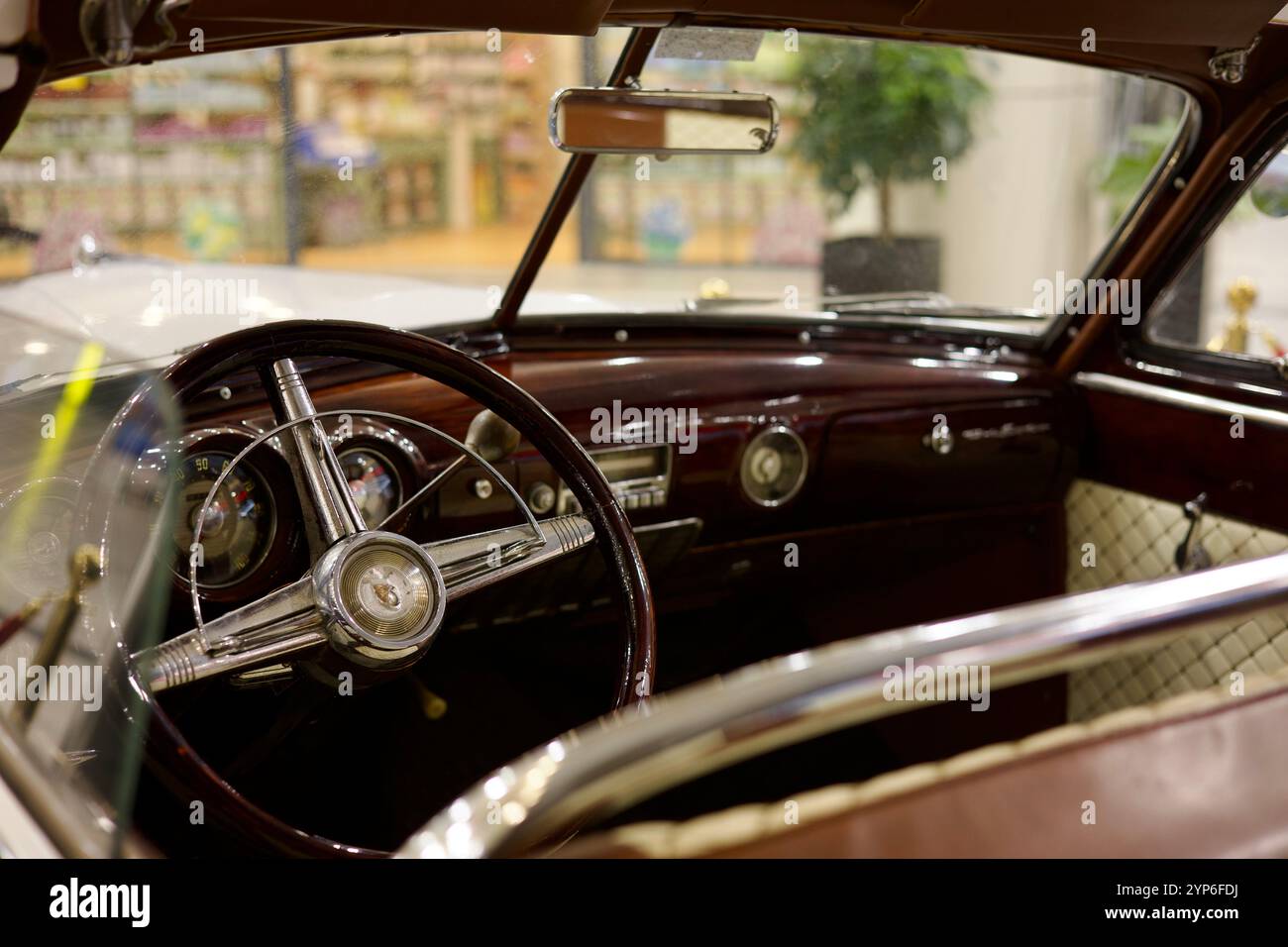 A collection of restored classic and luxury cars displayed at a vintage ...