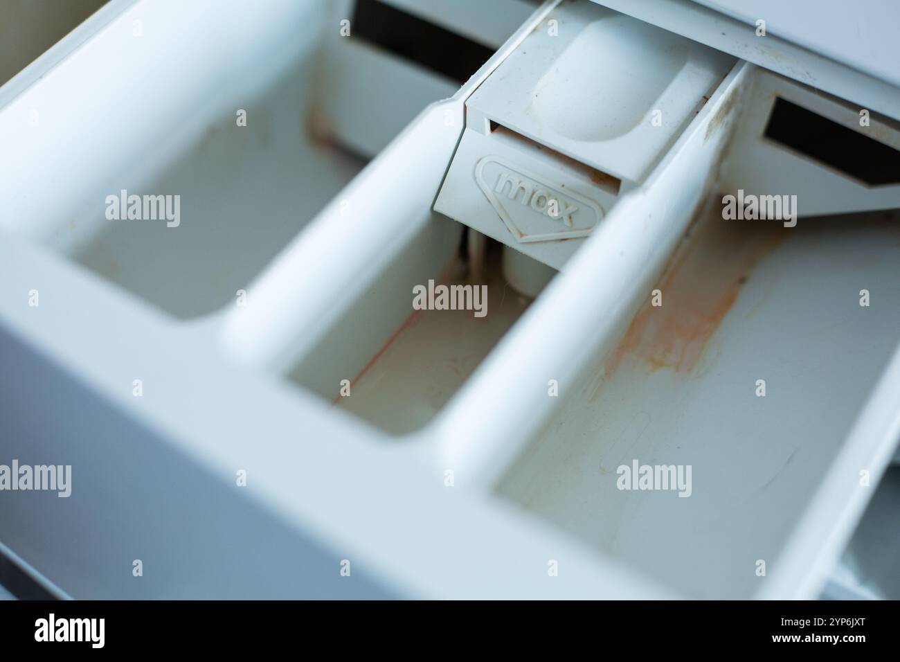 Dirty moldy compartment for laundry detergent, detergent and washing ...