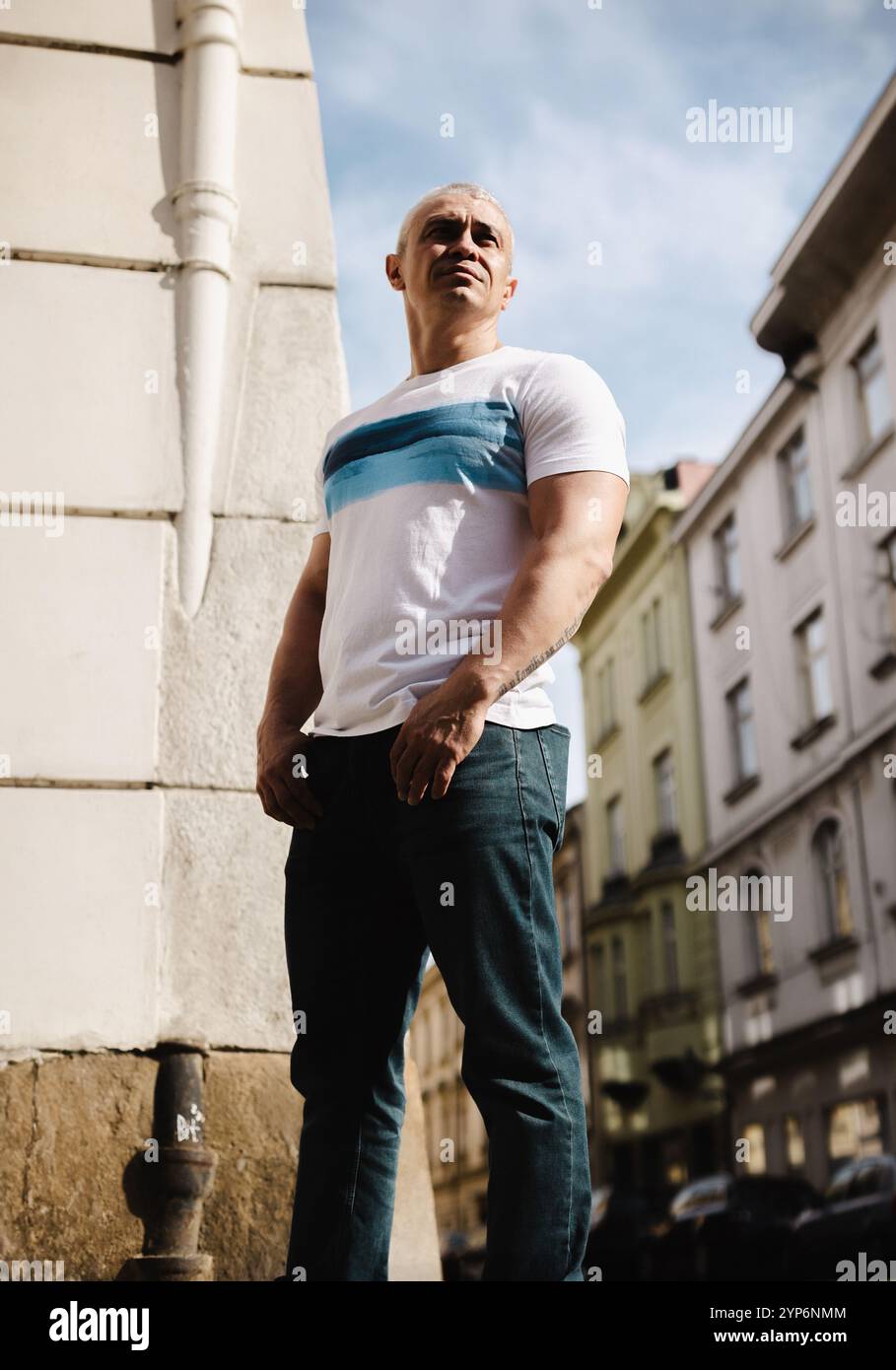 Attractive senior man stands hi-res stock photography and images - Alamy