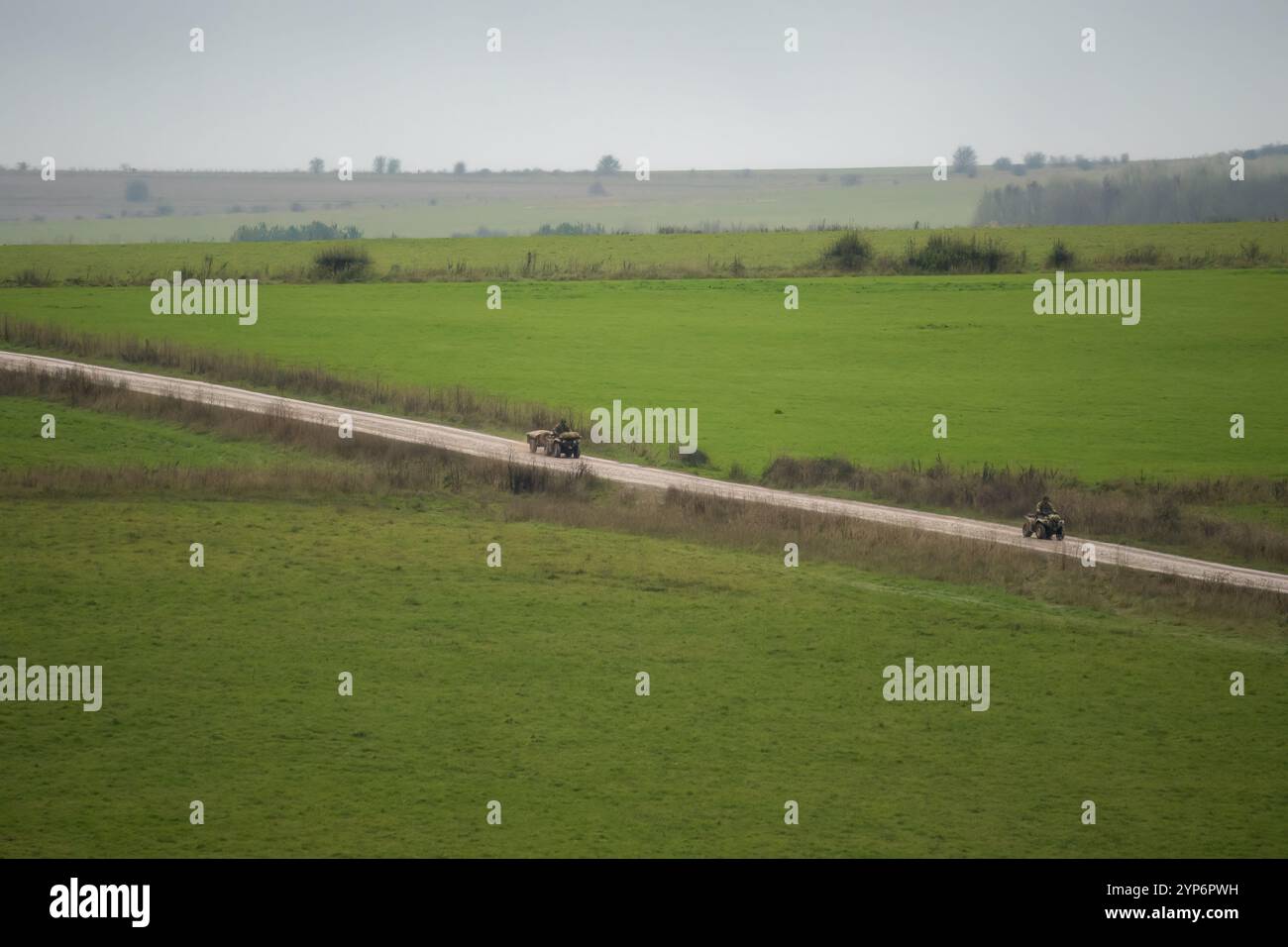 a convoy of British army ATV quad bike four wheeled all terrain bikes ...