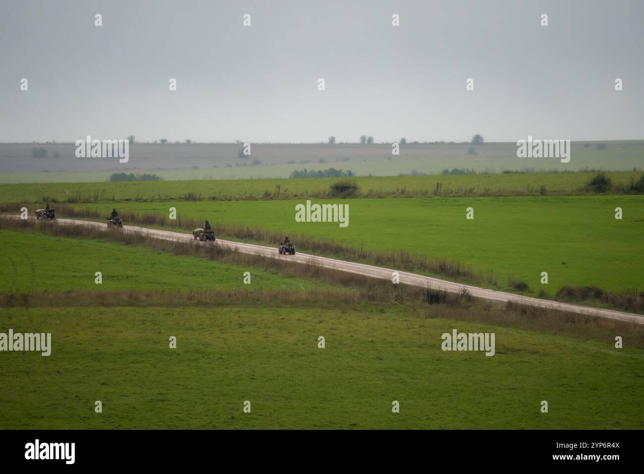 a convoy of British army ATV quad bike four wheeled all terrain bikes ...