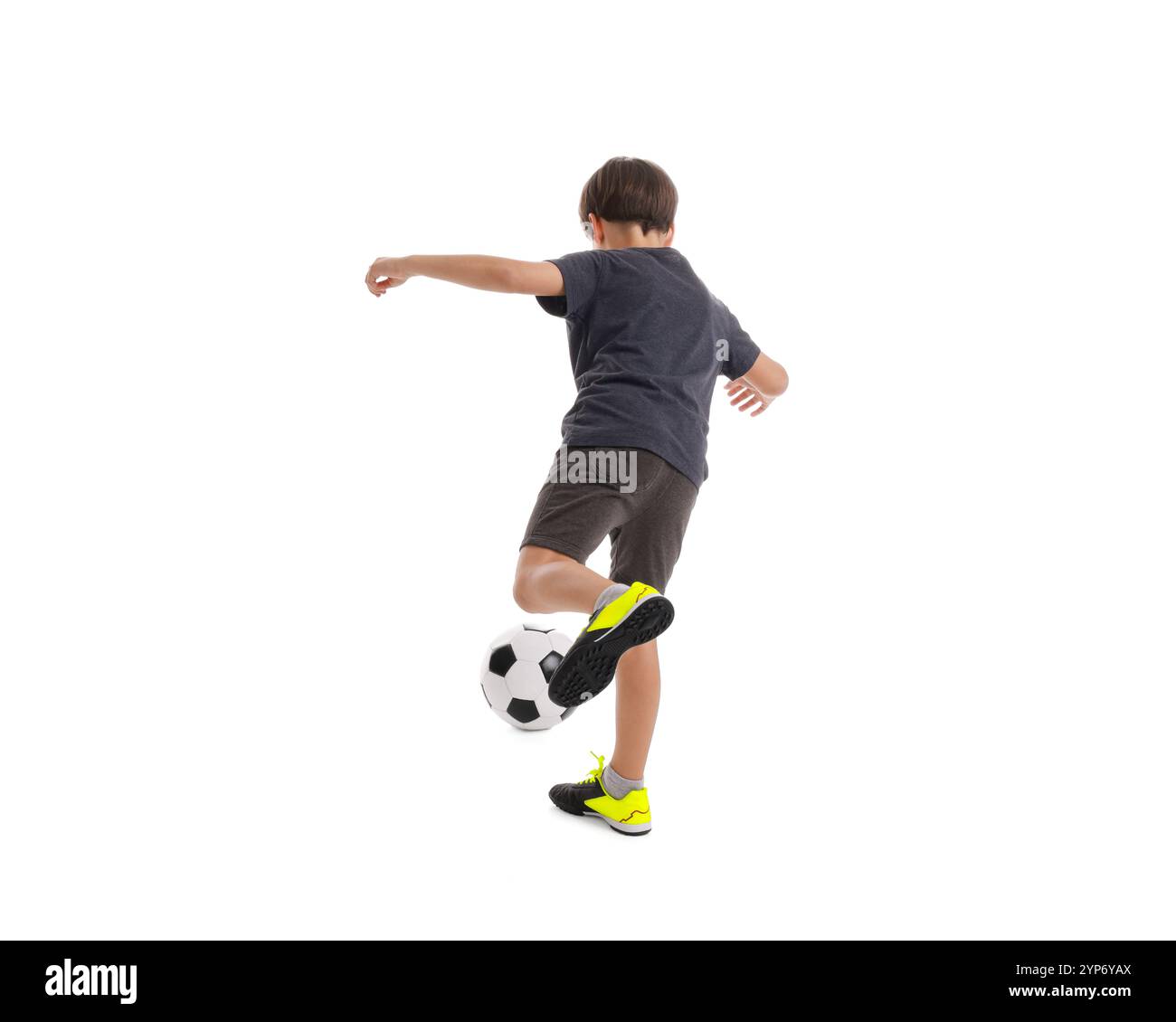 Boy with soccer ball playing football on white background, back view ...