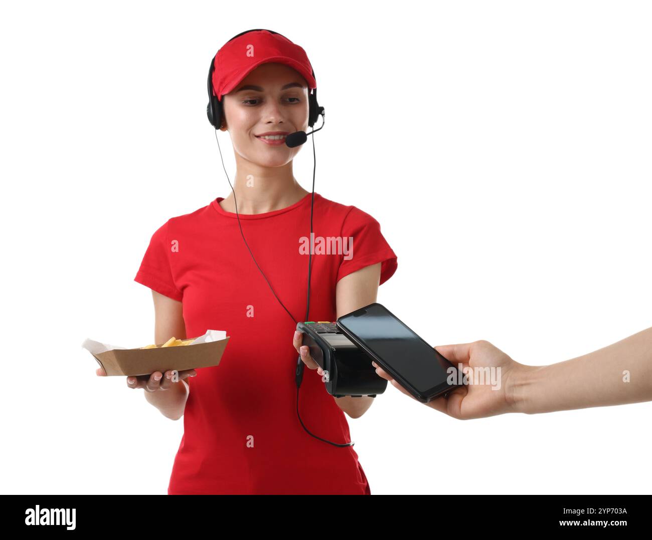 Fast-food worker taking payment from client via terminal on white ...