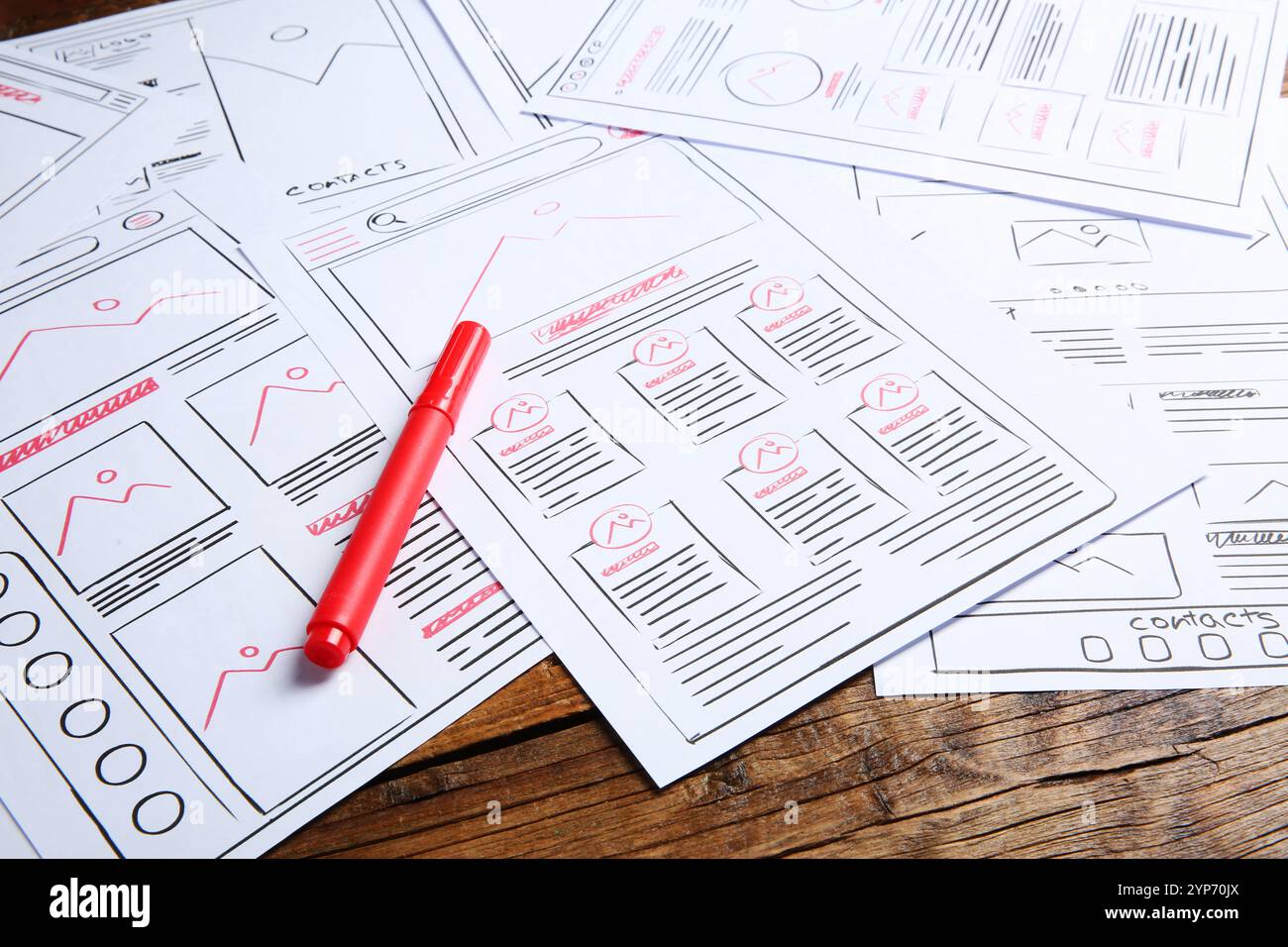 Developing UI design. Sketches of website wireframes and felt pen on ...