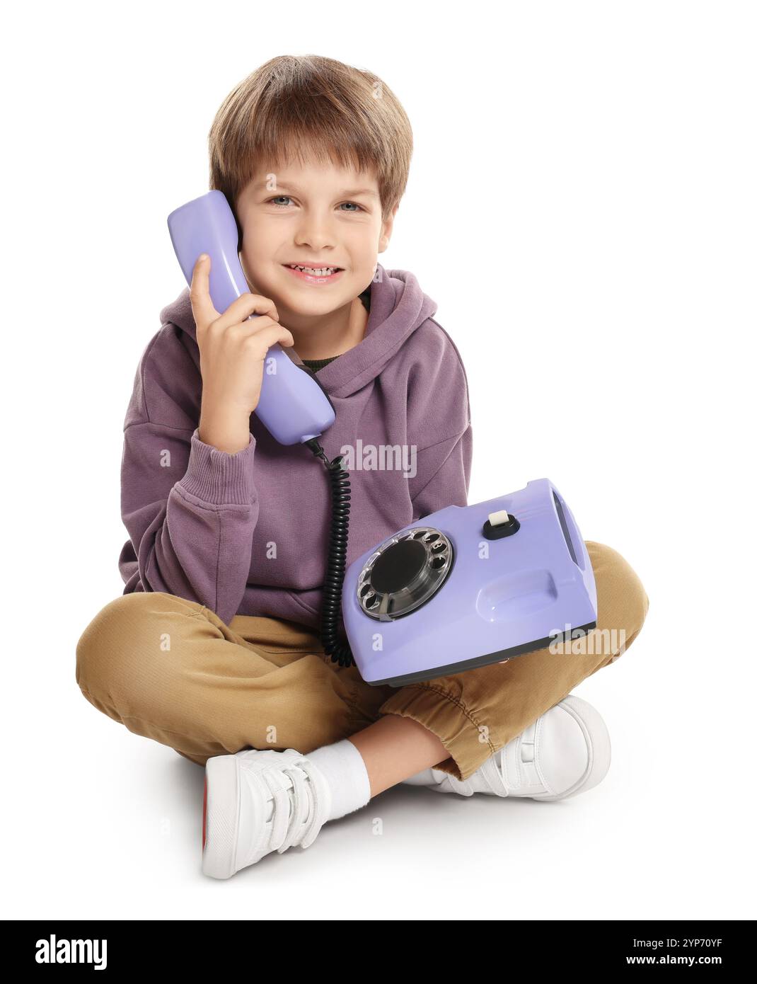 Cute little boy with old telephone on white background Stock Photo - Alamy
