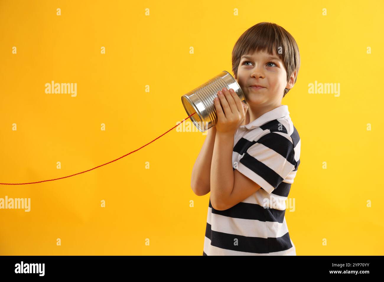 Kid using can telephone hi-res stock photography and images - Alamy
