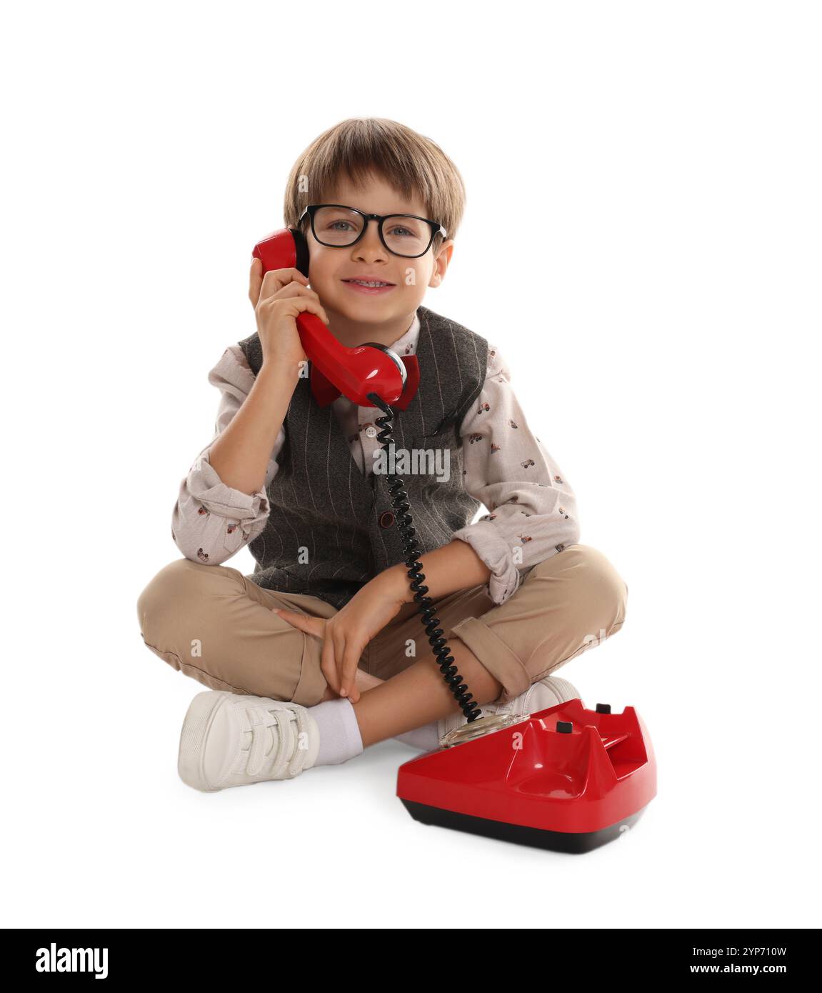 Cute little boy with old telephone on white background Stock Photo - Alamy