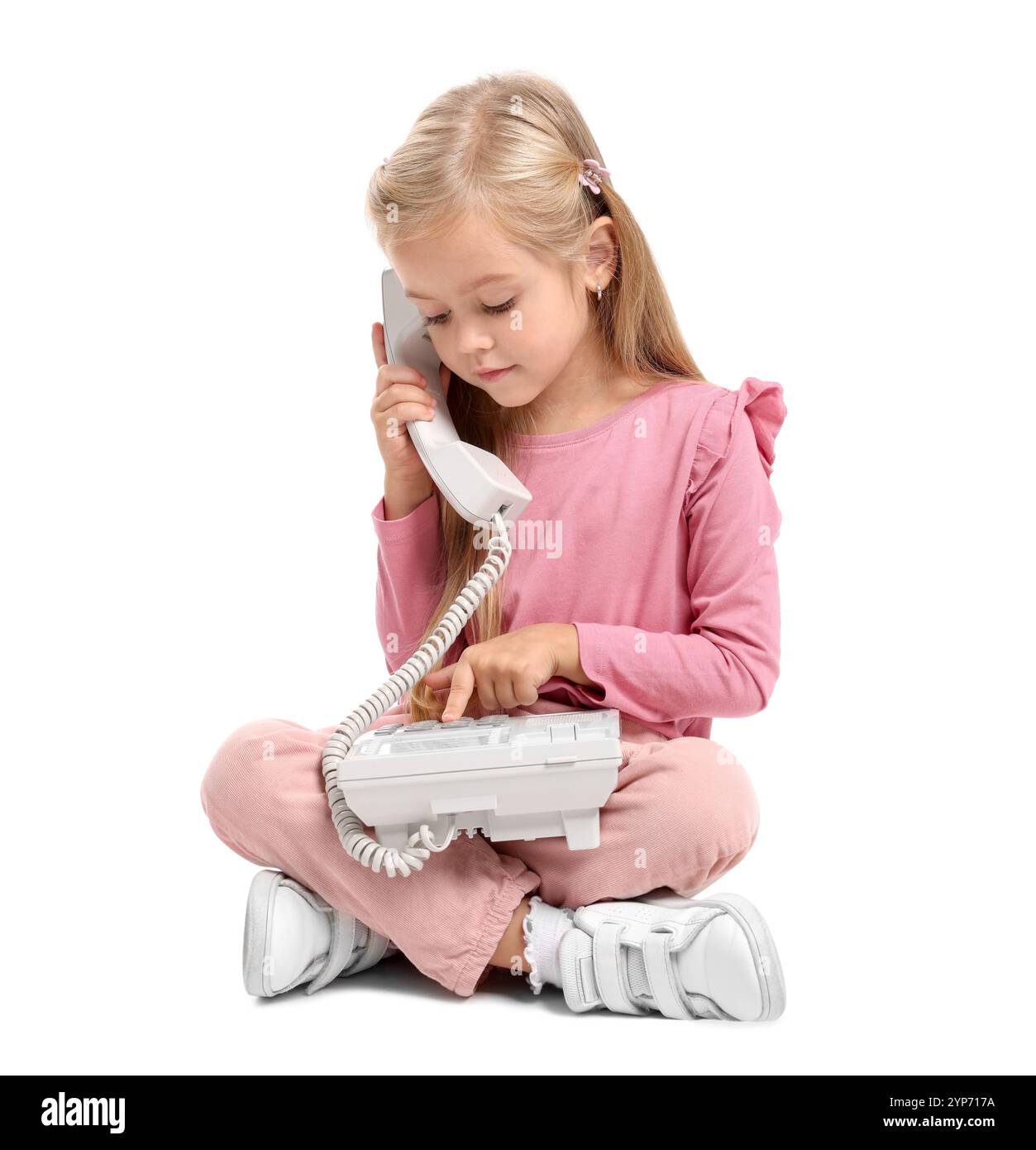 Cute little girl with telephone on white background Stock Photo - Alamy