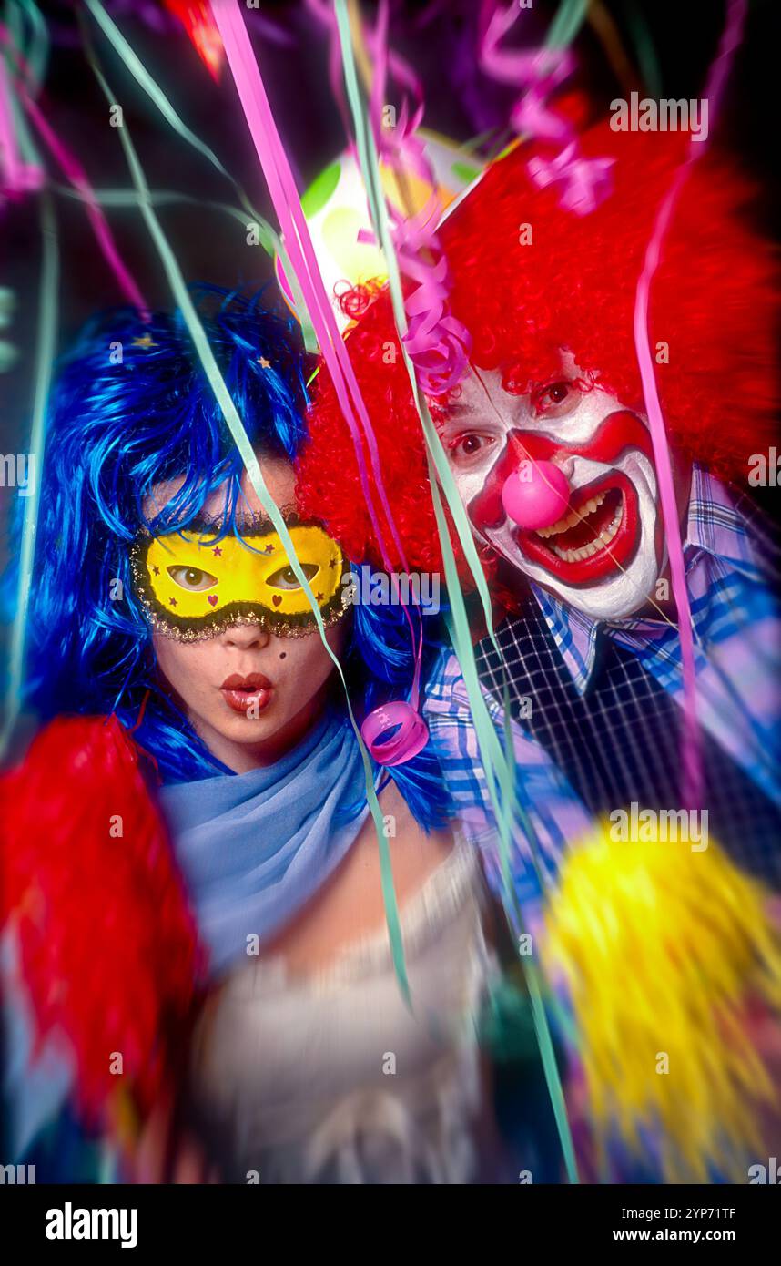 Couple of kids at carnival; a fairy and a clown Stock Photo - Alamy