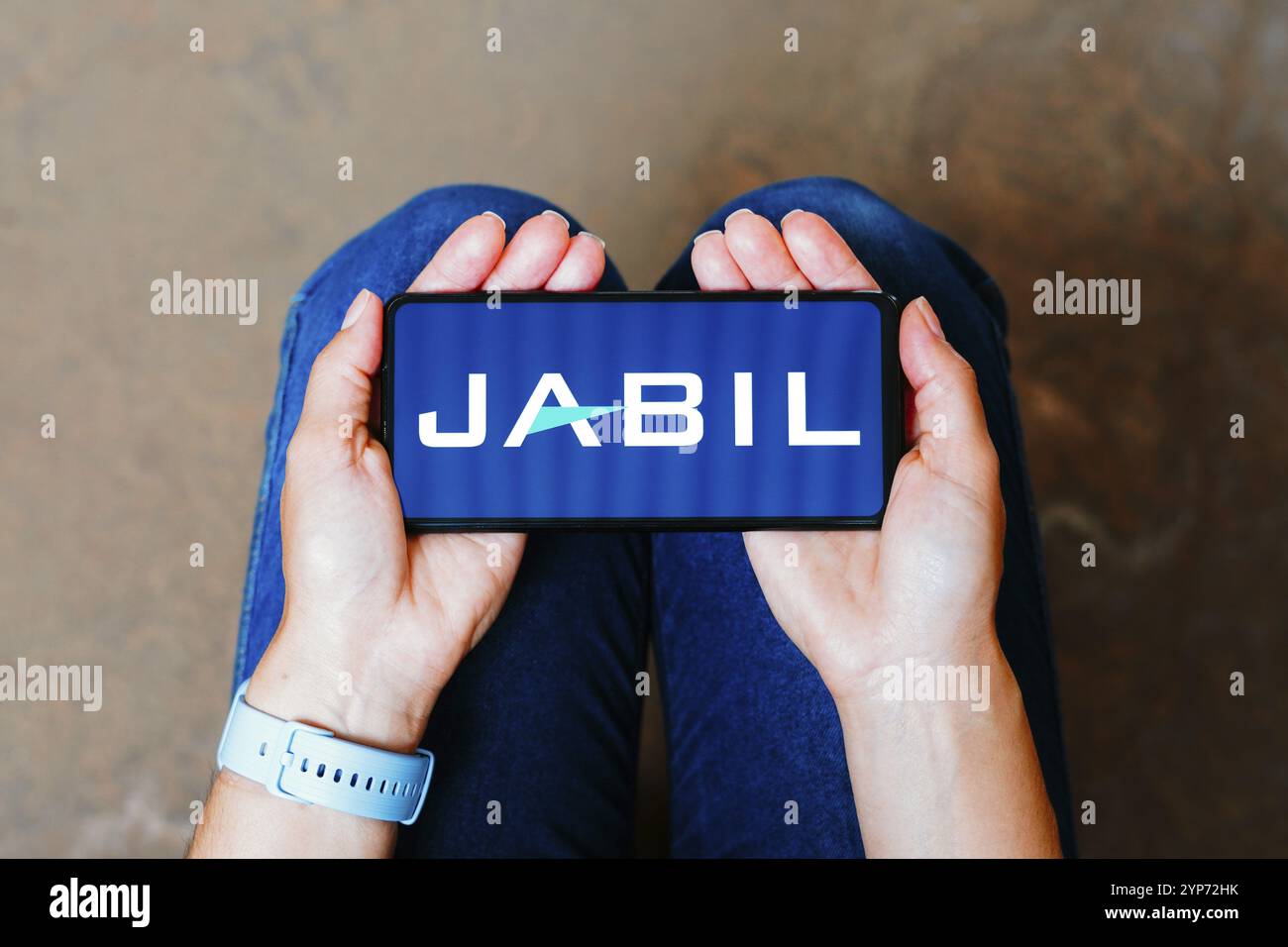 In this photo illustration, the Jabil logo is displayed on a smartphone ...