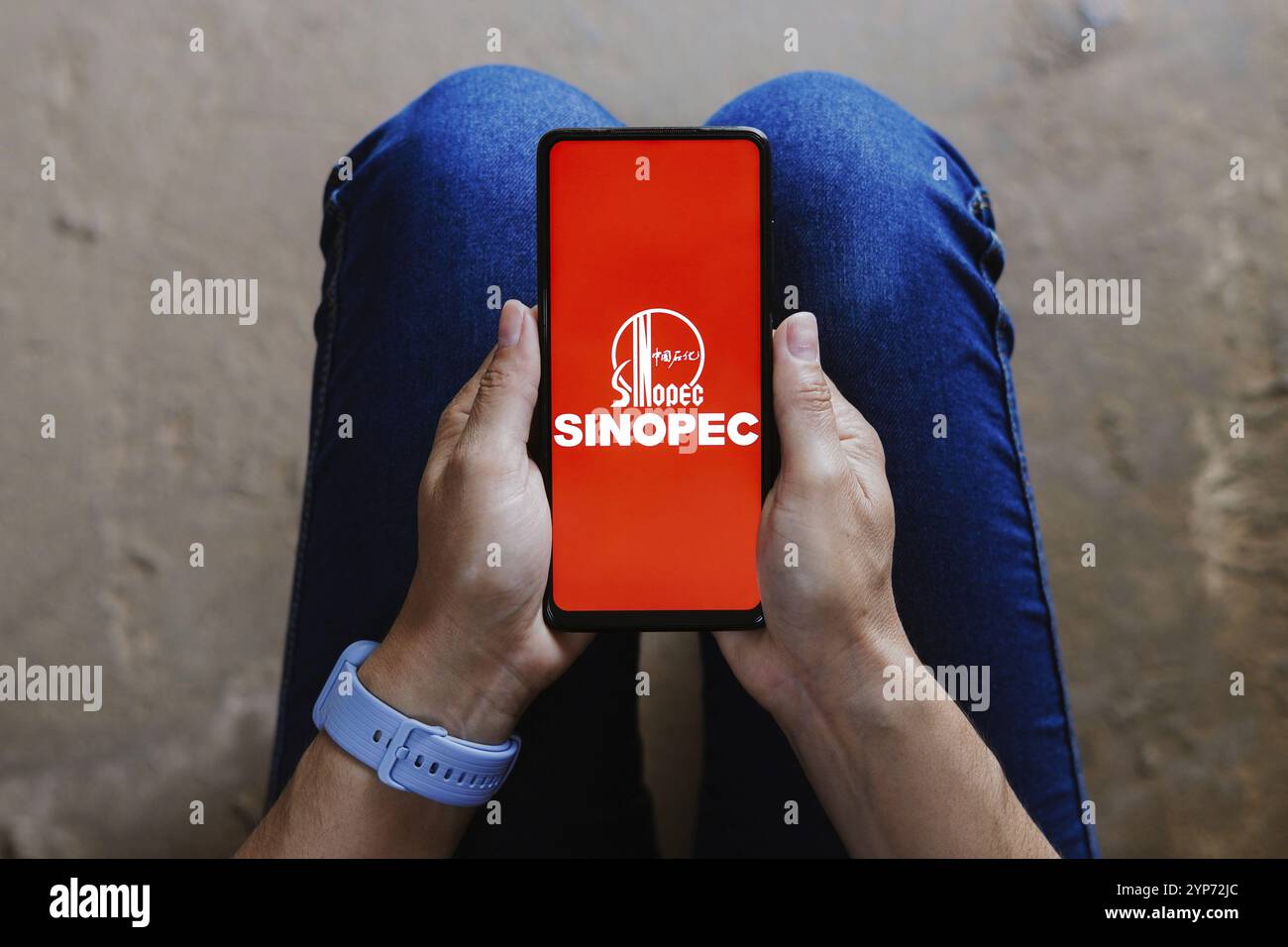 In this photo illustration, the Sinopec logo seen displayed on a ...