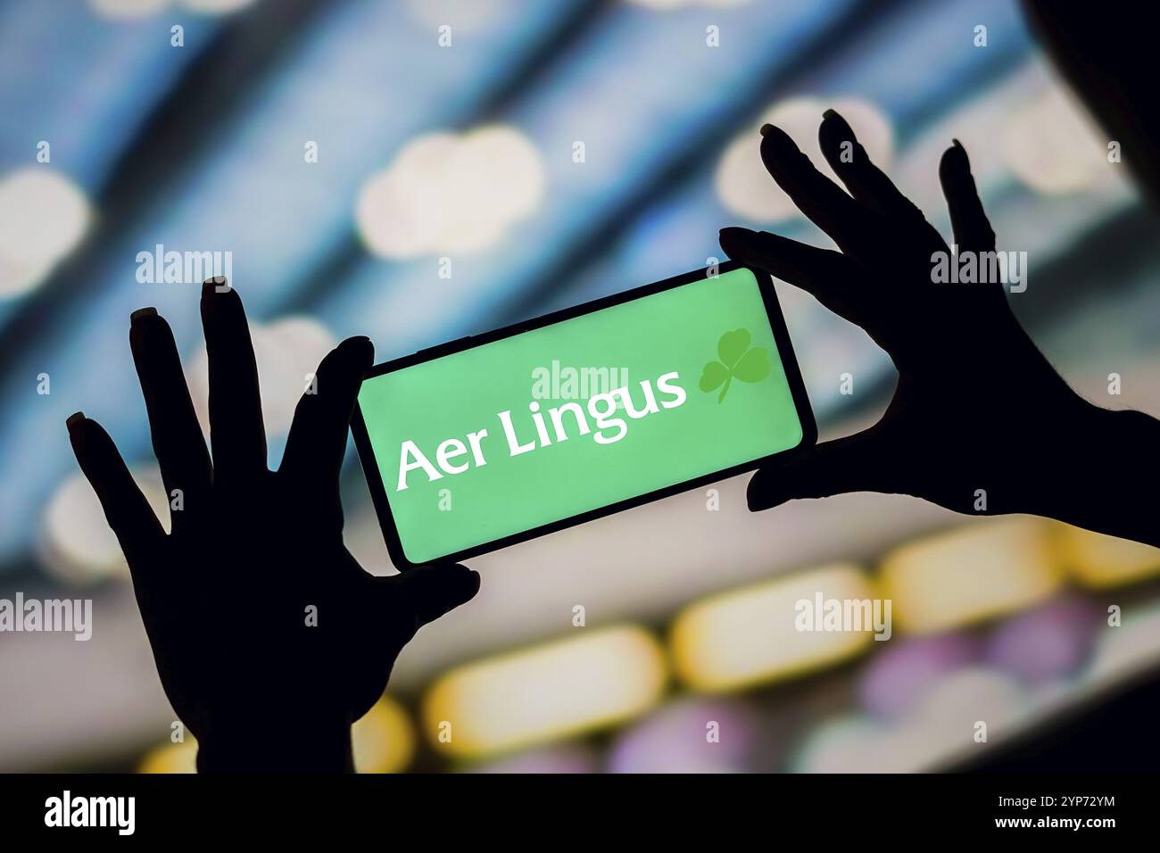 In this photo illustration, the Aer Lingus logo is displayed on a ...
