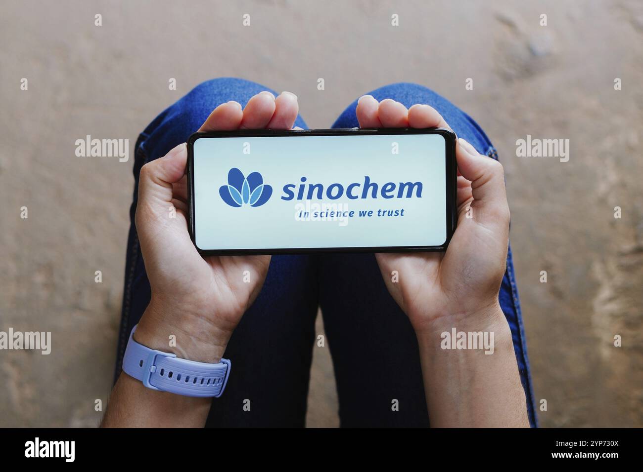 In this photo illustration, the Sinochem logo seen displayed on a smartphone Stock Photo - Alamy