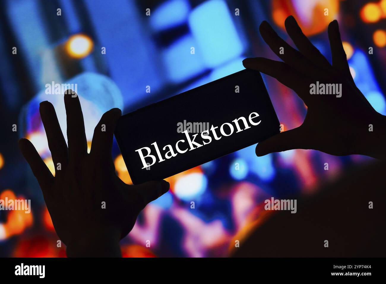 In this photo illustration, the Blackstone Group logo is displayed on a smartphone screen Stock ...