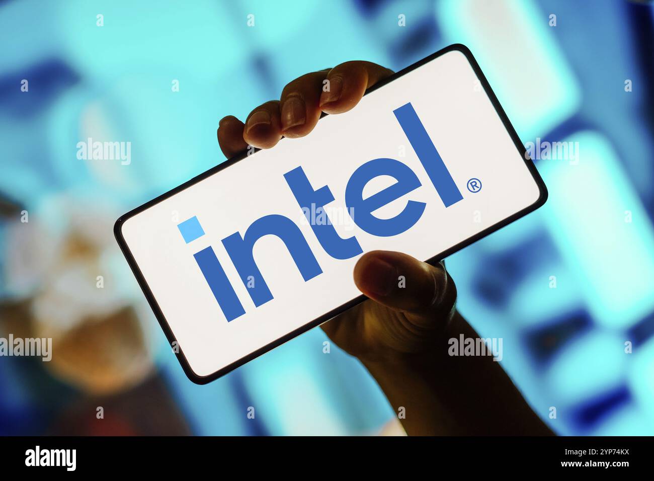 In this photo illustration, the Intel logo is displayed on a smartphone ...