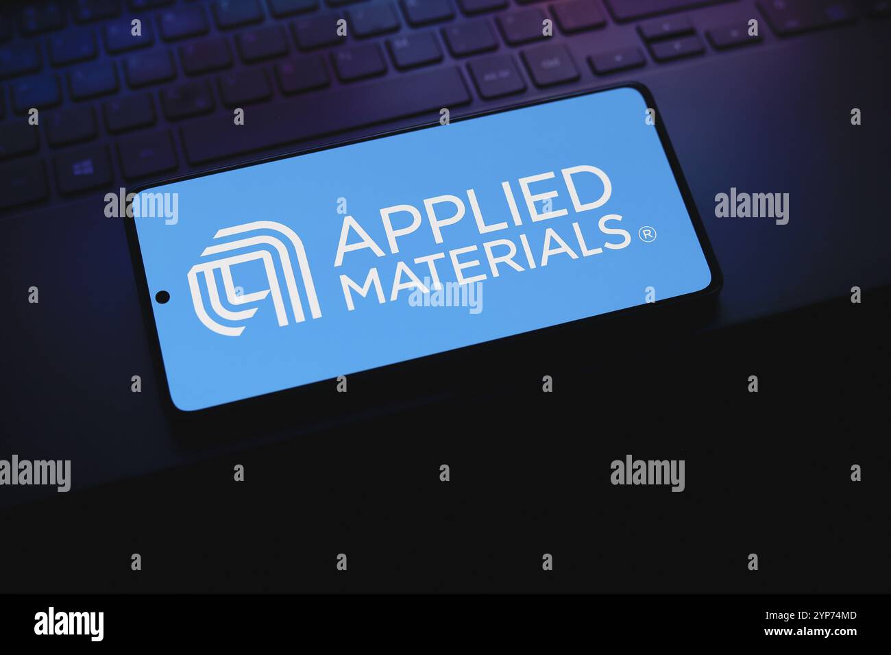 In this photo illustration, the Applied Materials logo is displayed on ...