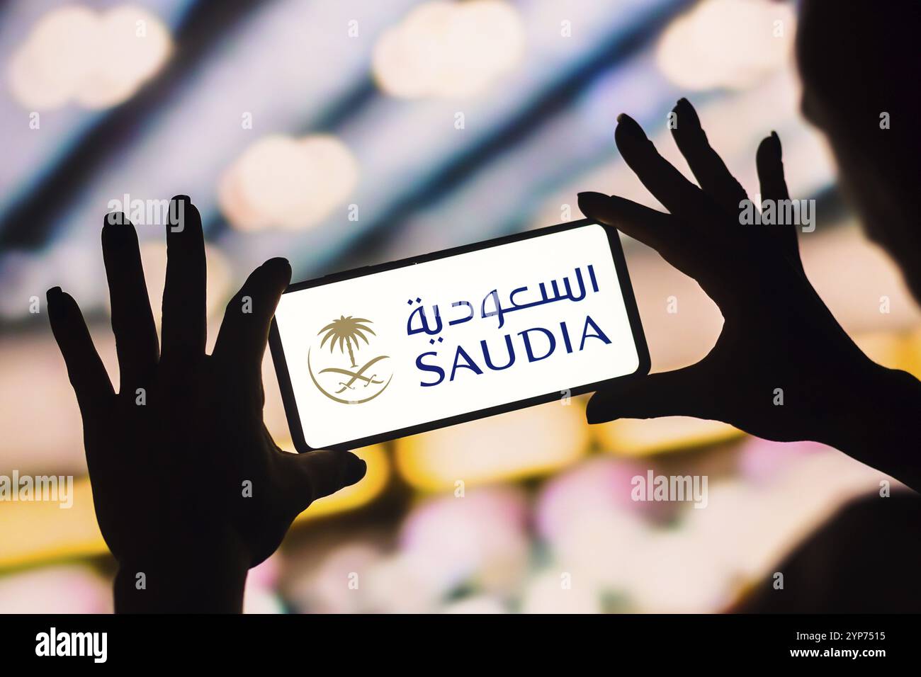 In this photo illustration, the Saudia logo is displayed on a ...