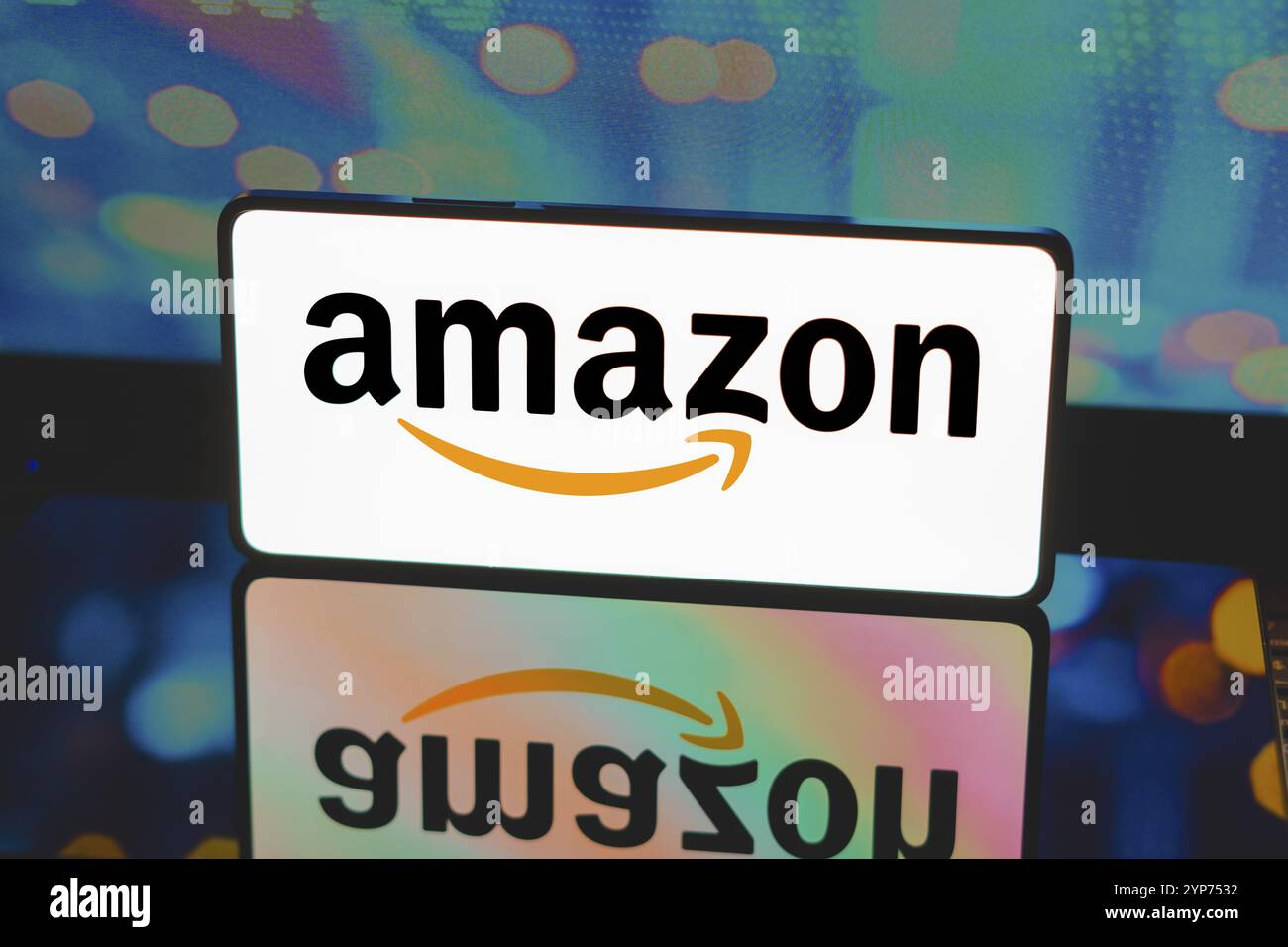 In this photo illustration, the Amazon logo is displayed on a ...