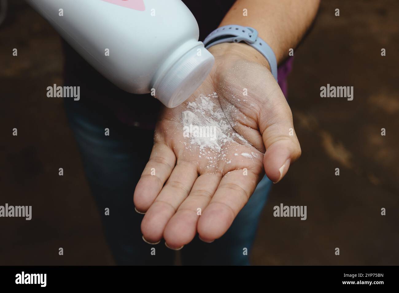 In this photo illustration, a person uses Johnson Johnson baby powder ...