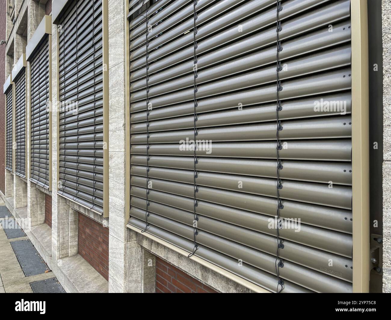 Windows with lowered shutters Stock Photo - Alamy