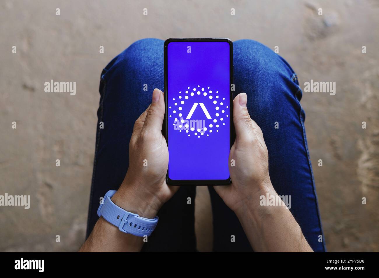 In this photo illustration, the Stellantis logo seen displayed on a ...