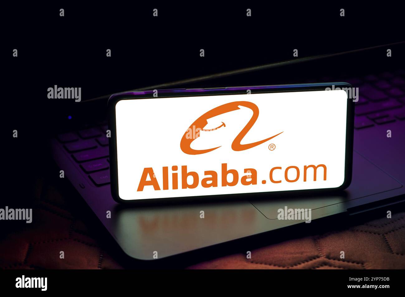 In this photo illustration, the Alibaba logo is displayed on a ...