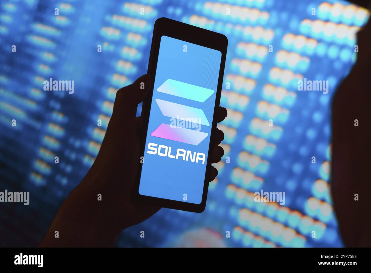 In this photo illustration, the Solana logo is displayed on a ...