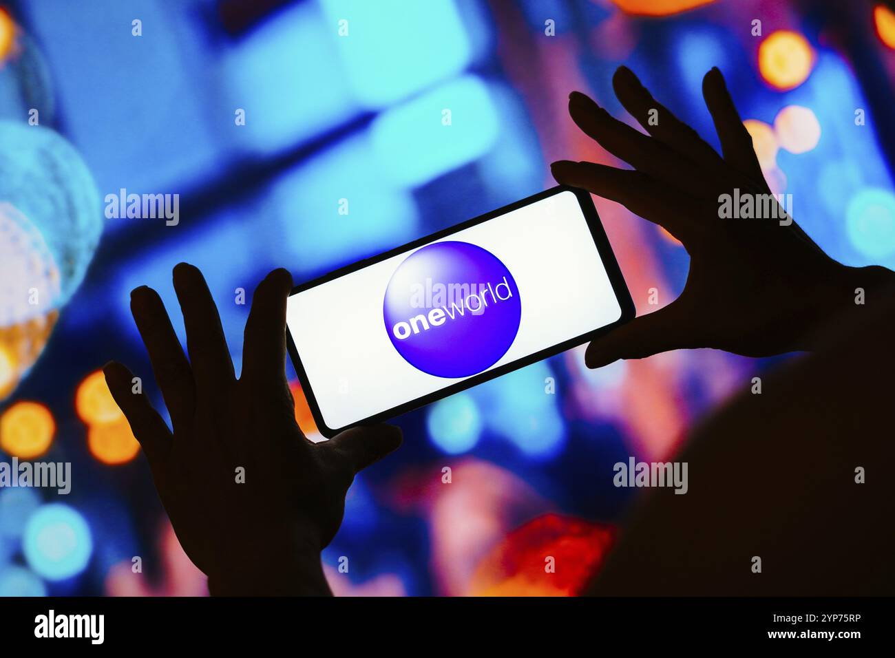 In this photo illustration, the Oneworld logo seen displayed on a ...