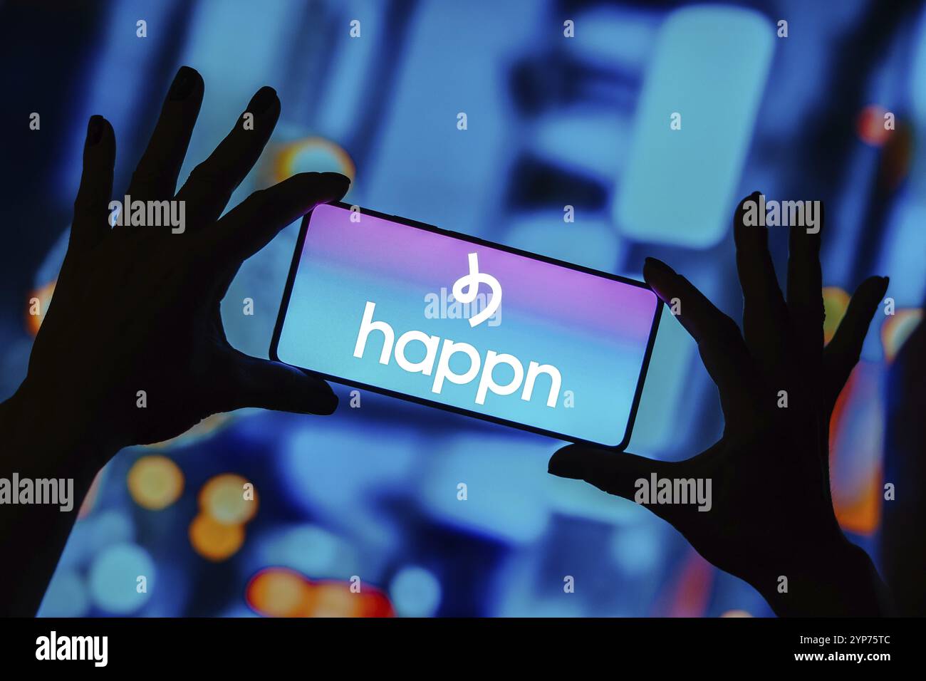 In this photo illustration, the Happn logo is displayed on a smartphone screen Stock Photo - Alamy