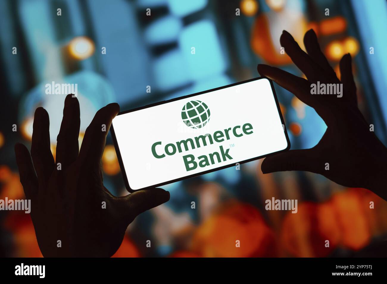In this photo illustration, the Commerce Bank logo is displayed on a ...