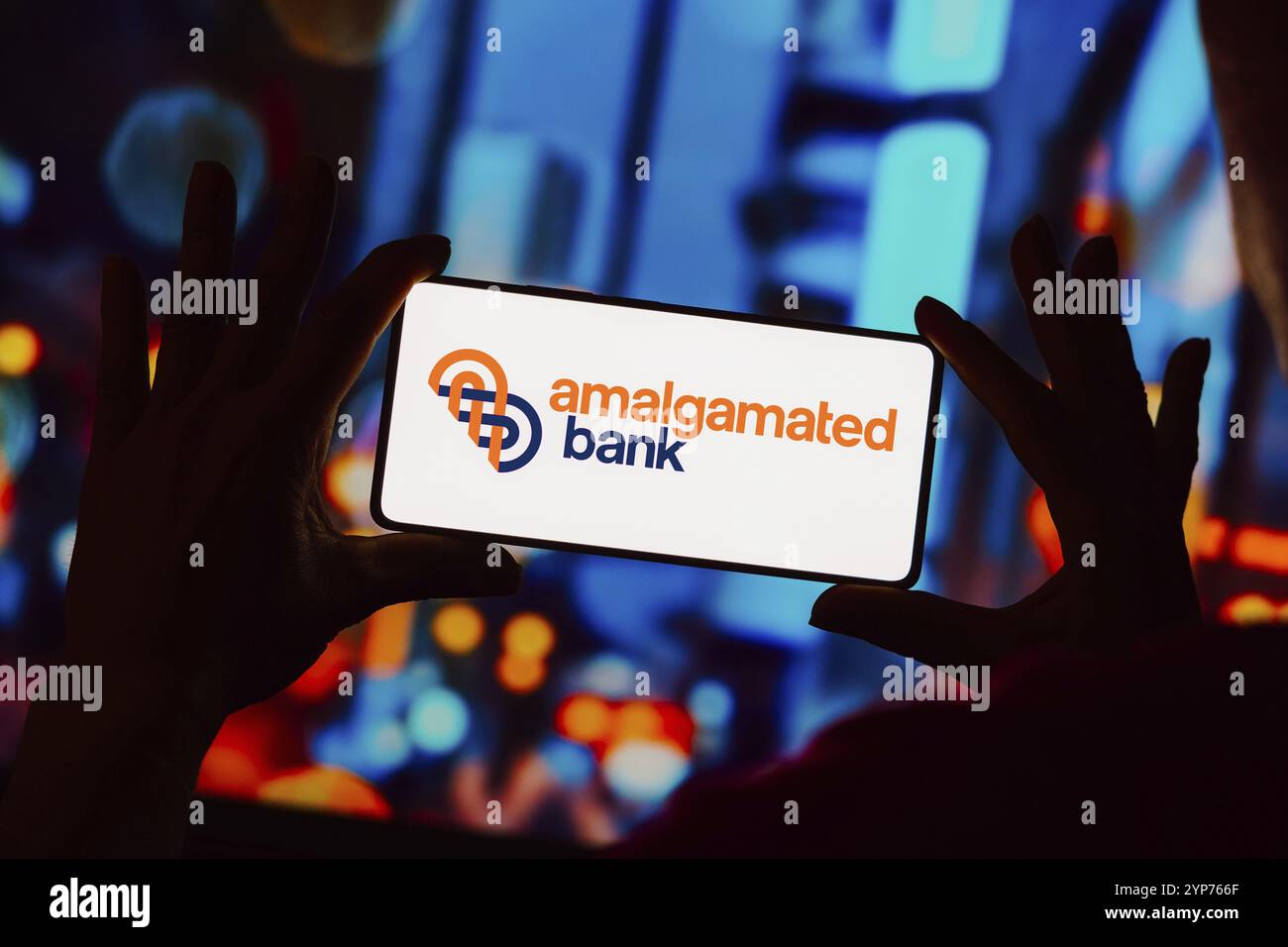 In this photo illustration, the Amalgamated Bank logo is displayed on a ...