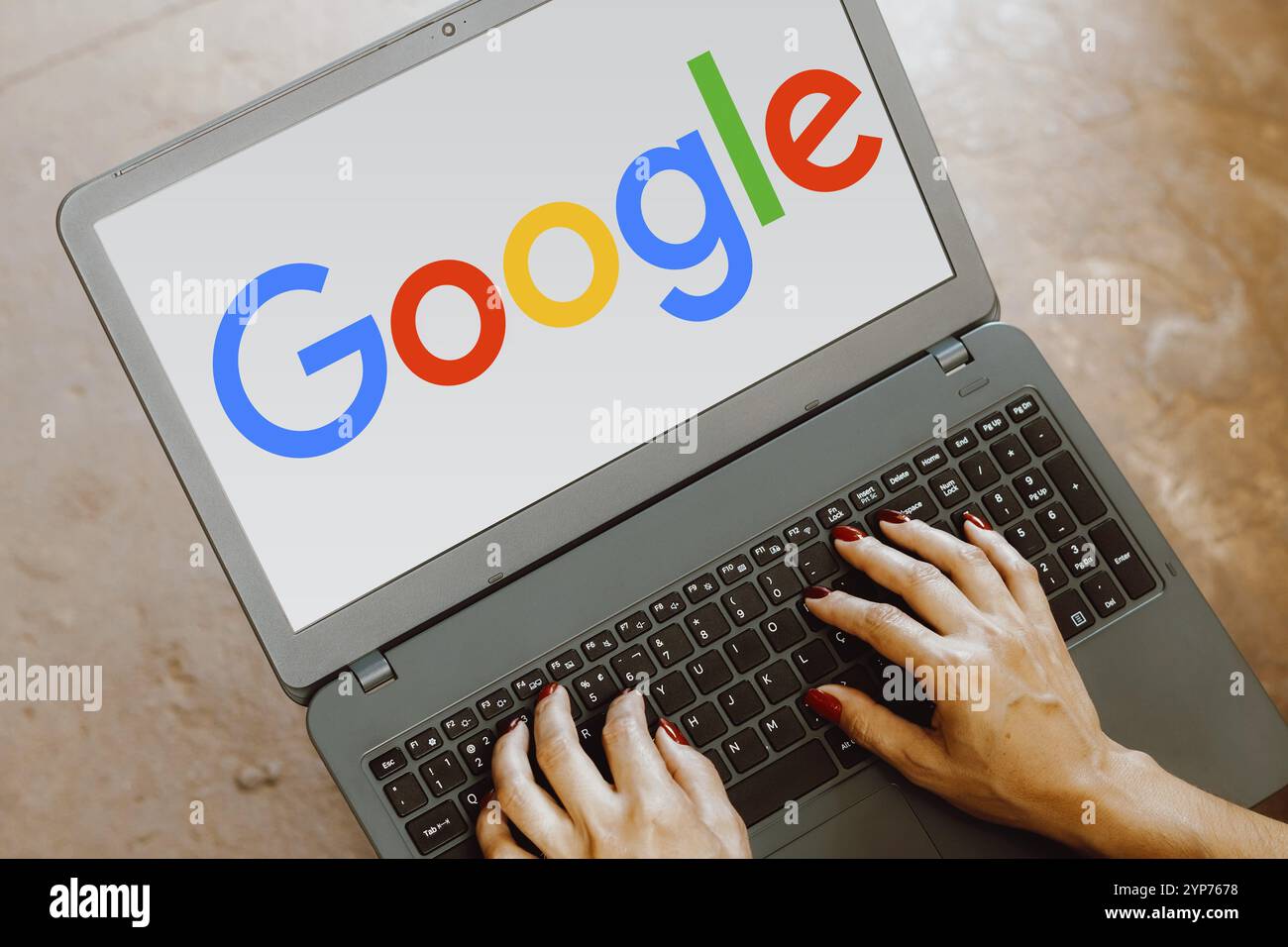 In this photo illustration, the Google logo is displayed on a notebook ...